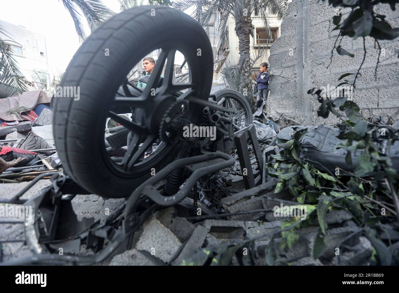 Palestinians inspect the rubble of a destroyed house of Islamic Jihad ...