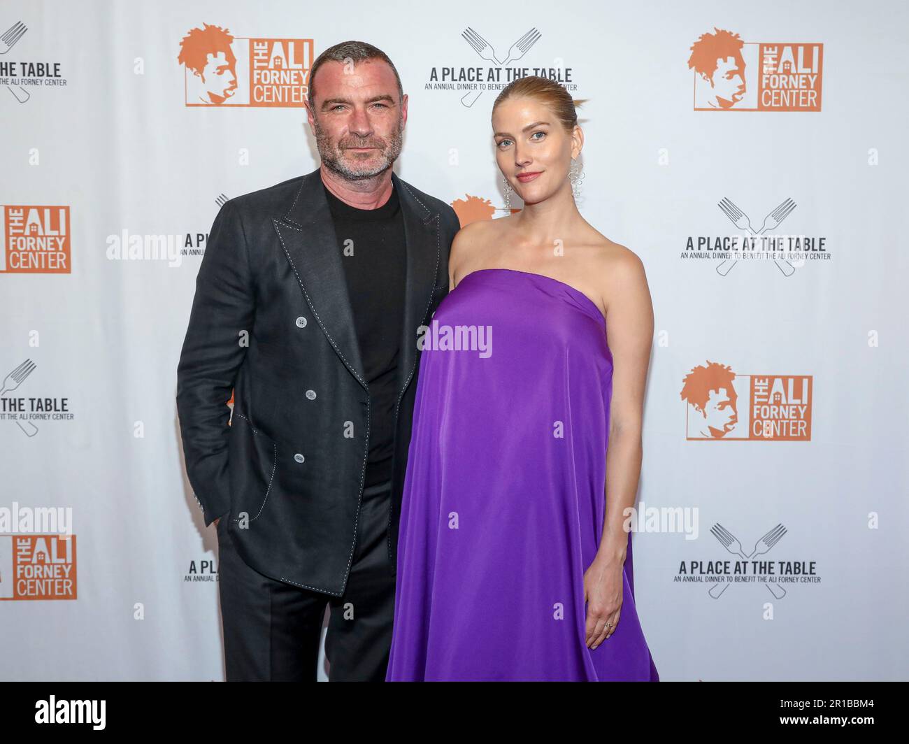 Actor Liev Schreiber, left, and fashion model Taylor Neisen attend the ...