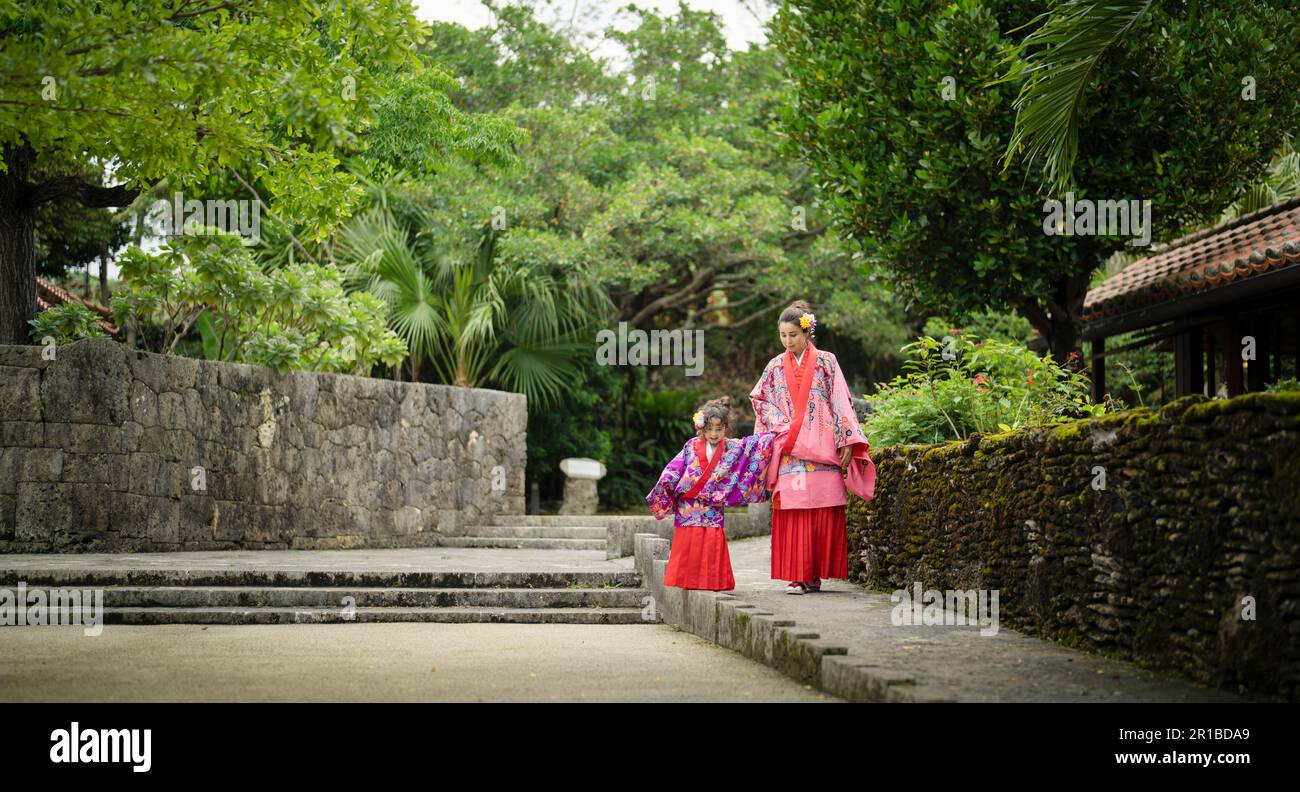 Okinawan mother and daughter wearing traditional Okinawan ryusou ...
