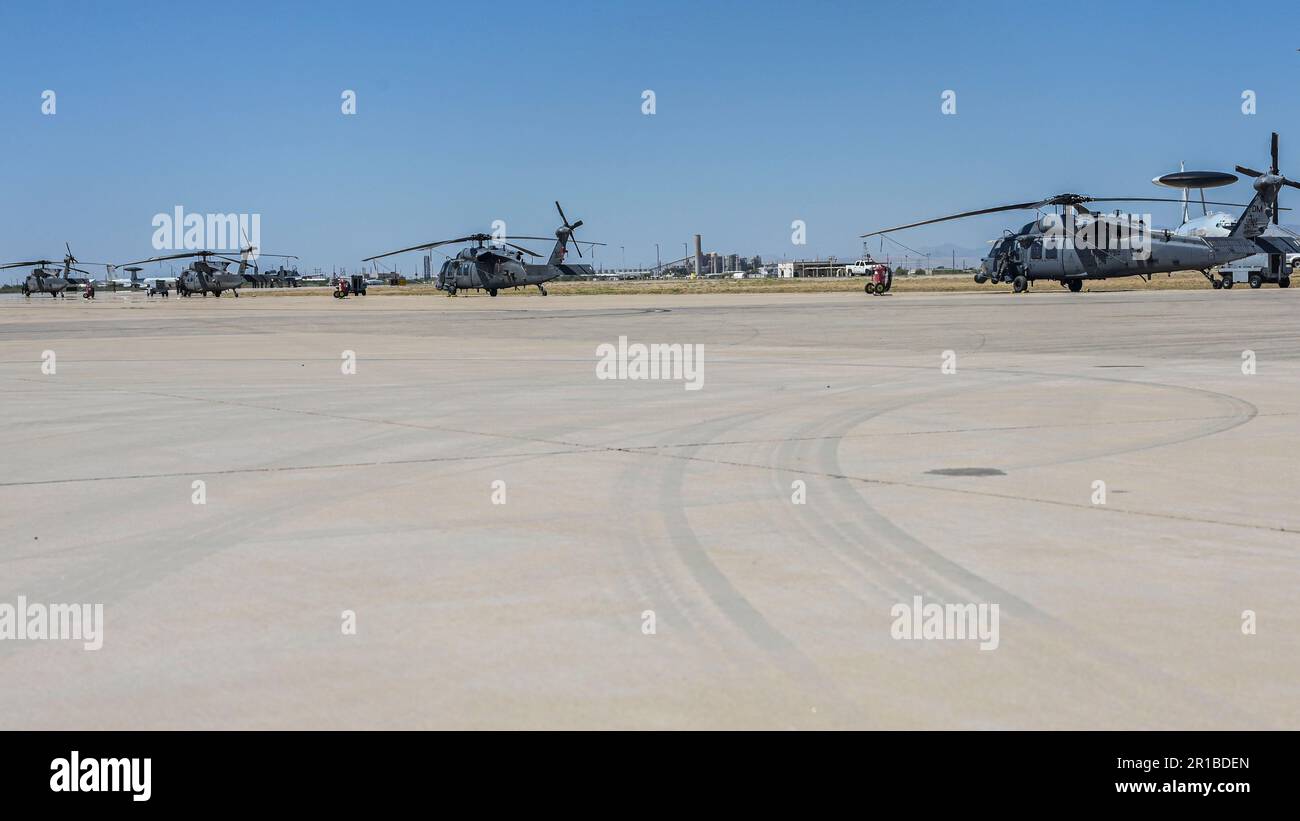 Multiple U.S. Air Force HH-60G Pave Hawk helicopters sit on the flight ...