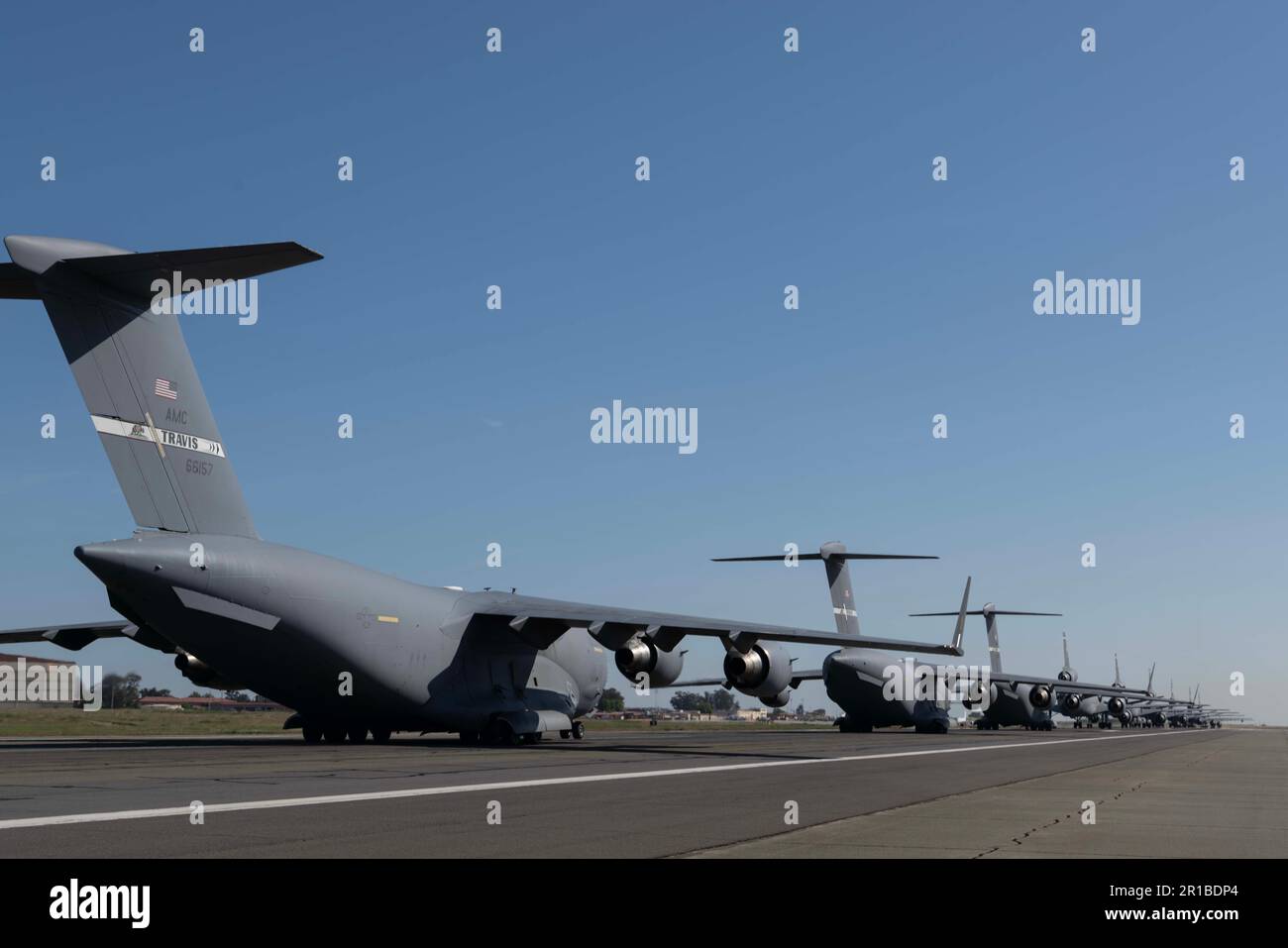 A formation of 21 aircraft line the runway as part of a maximum ...