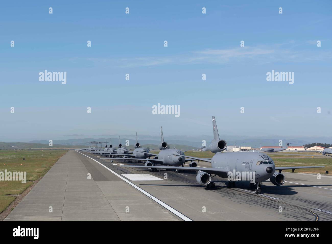 A formation of 21 aircraft line the runway as part of a maximum ...