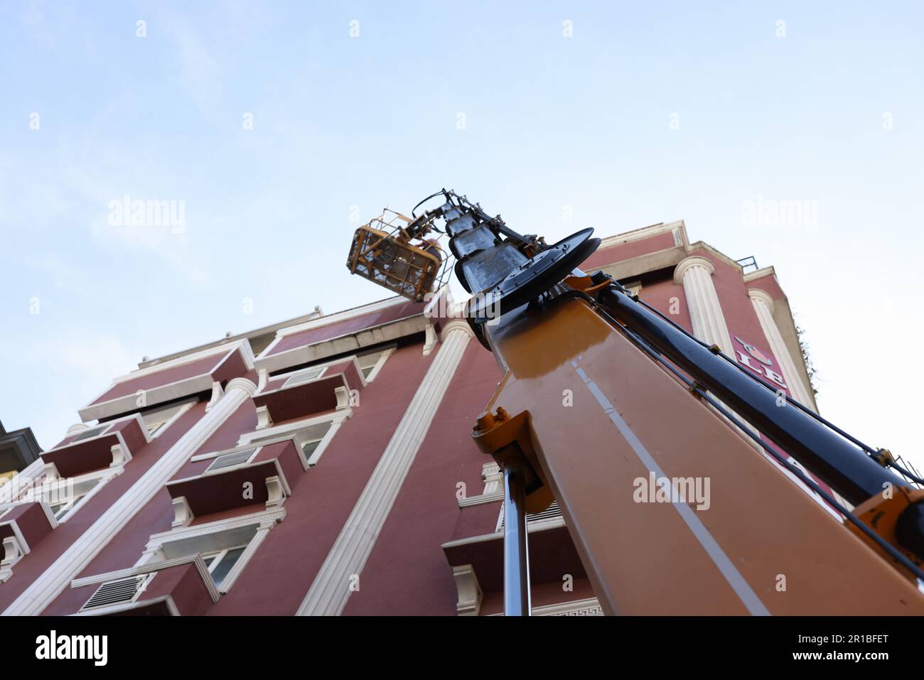 Construction cradle on crane hoist near restoring building Stock Photo ...