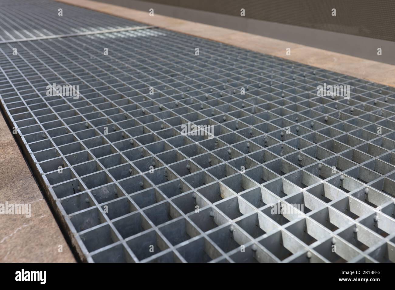 Metal bar grating over technical channel in marble floor Stock Photo ...