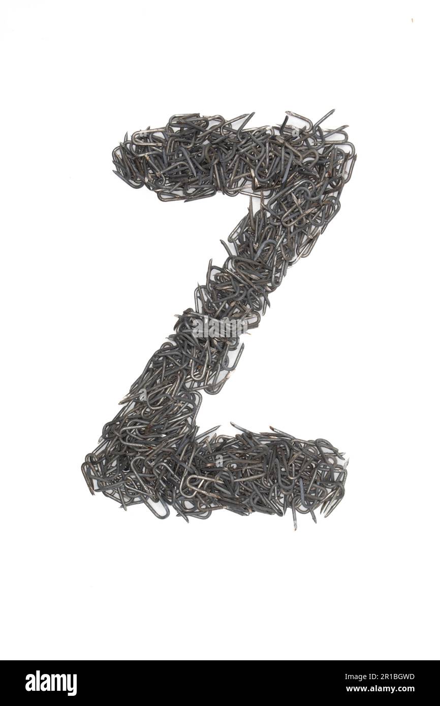 artistic isolated Letter Z made from steel staples isolated on a white ...