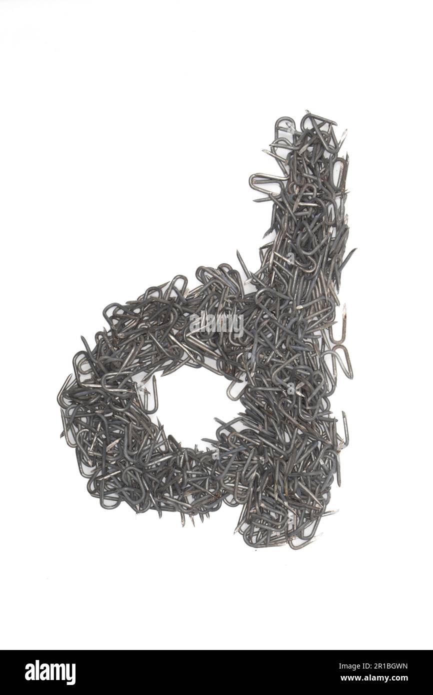artistic isolated Letter d made from steel staples isolated on a white ...