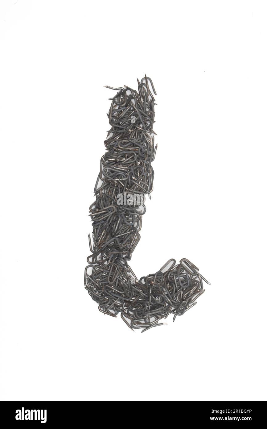 artistic isolated Letter l made from steel staples isolated on a white ...