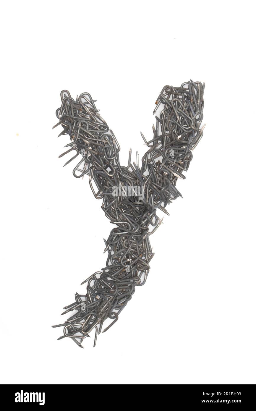 artistic isolated Letter y made from steel staples isolated on a white ...