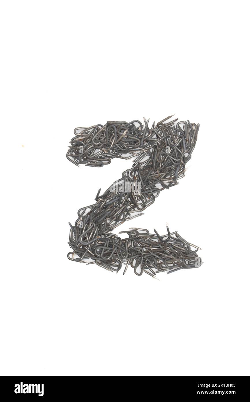 artistic isolated Letter z made from steel staples isolated on a white ...