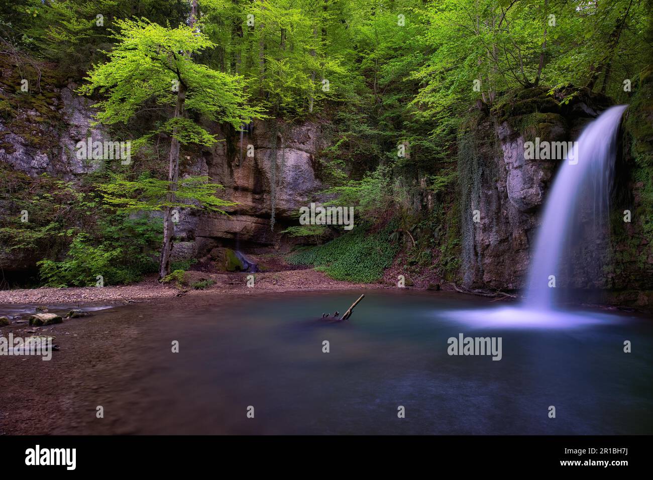Waterfall in the forest with small pond near Kilchberg, Canton Basel ...
