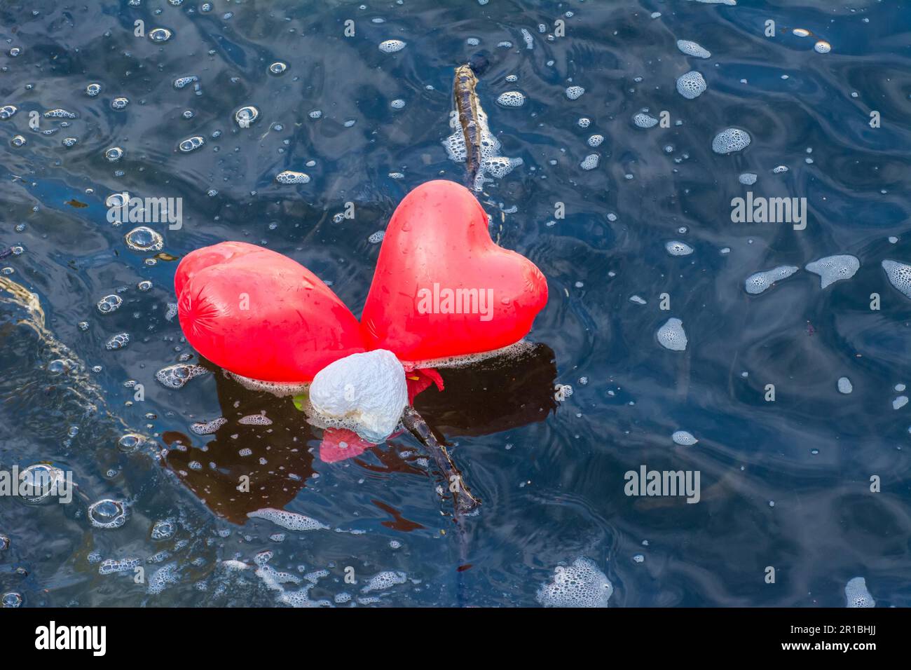 Love is flowing away, two heart shaped balloons in the water Stock ...
