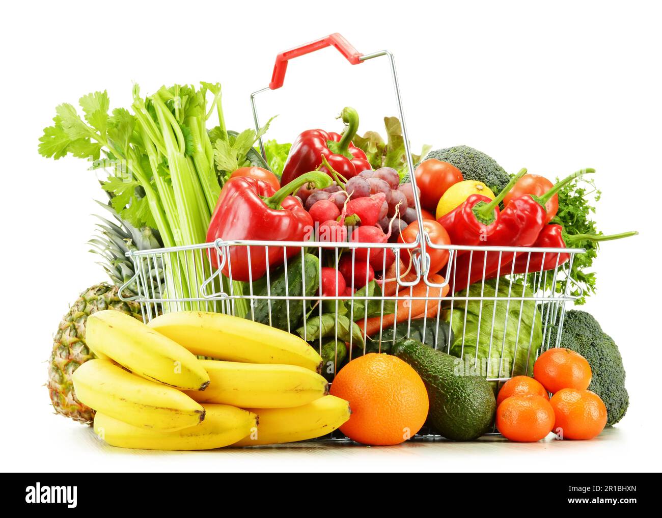 Wire shopping basket with groceries isolated on white background Stock ...