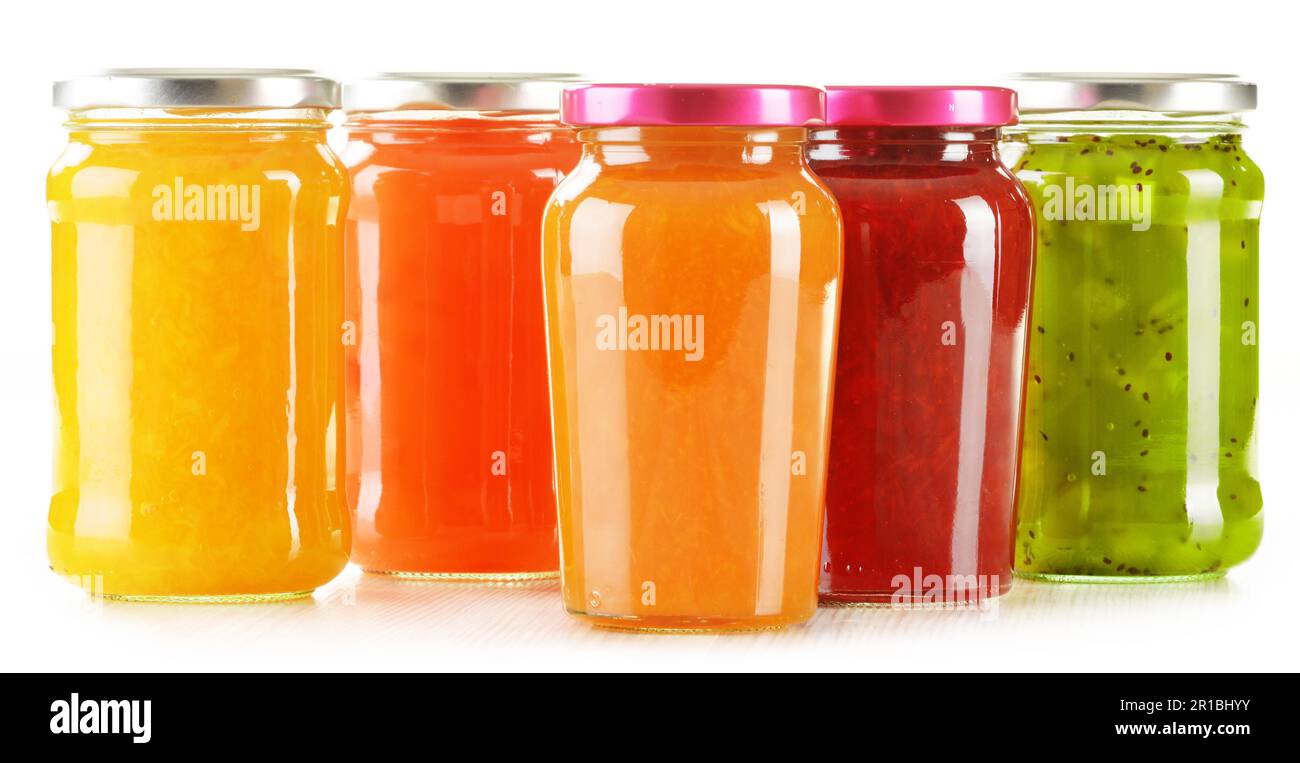 Jars of fruity jams isolated on white background. Preserved fruits ...