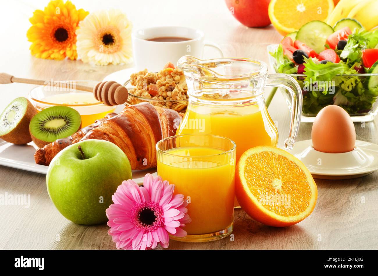 Breakfast with coffee, juice, croissant, salad, muesli and egg. Swedish ...