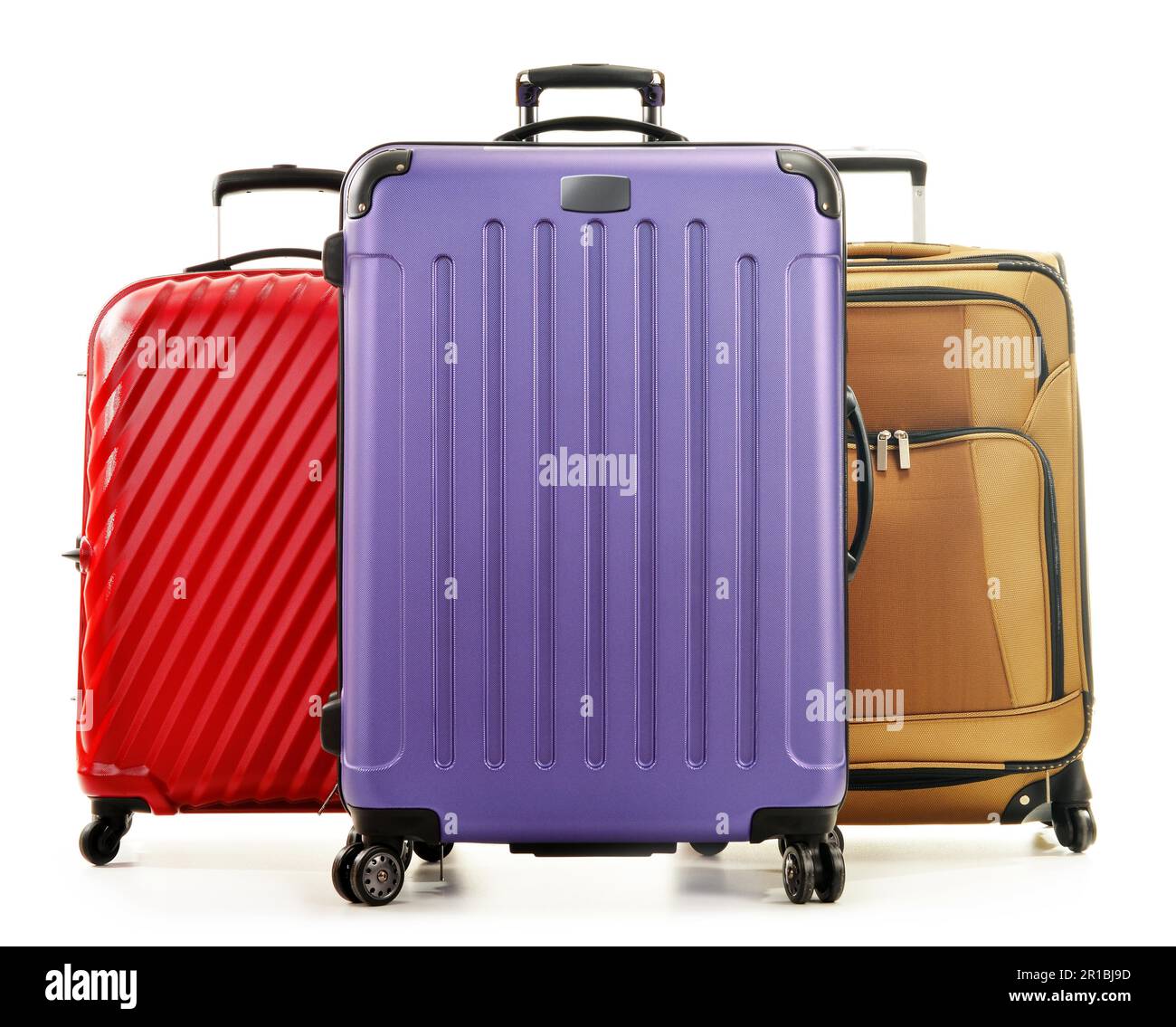 Three large suitcases isolated on white background Stock Photo - Alamy
