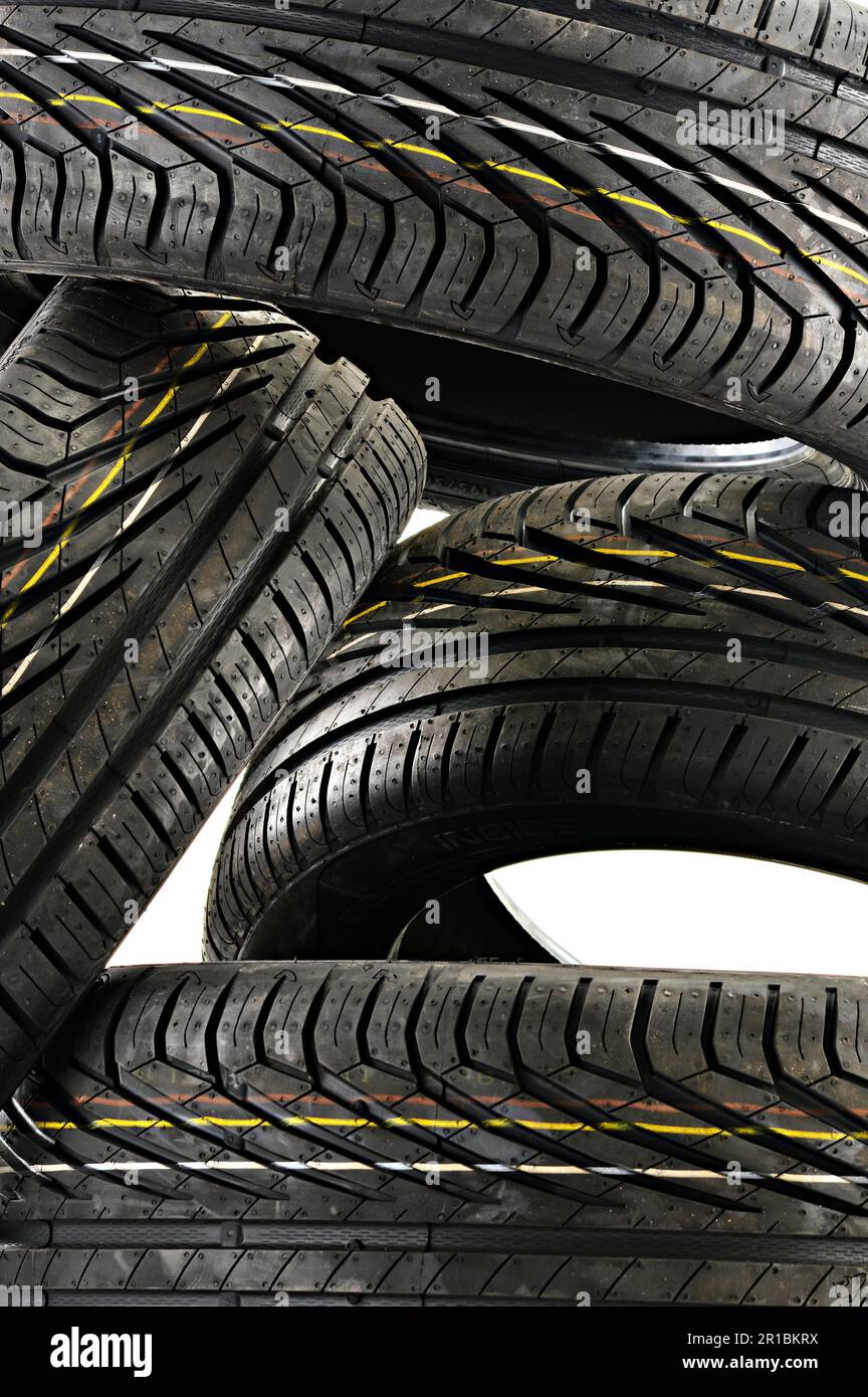 Four new black tires isolated on white background Stock Photo - Alamy