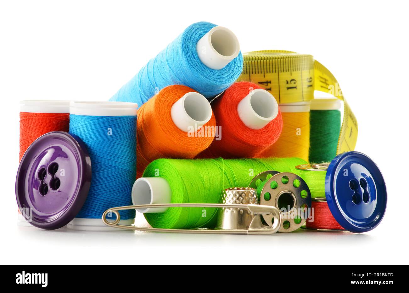 Composition with tailor threads over white background Stock Photo - Alamy