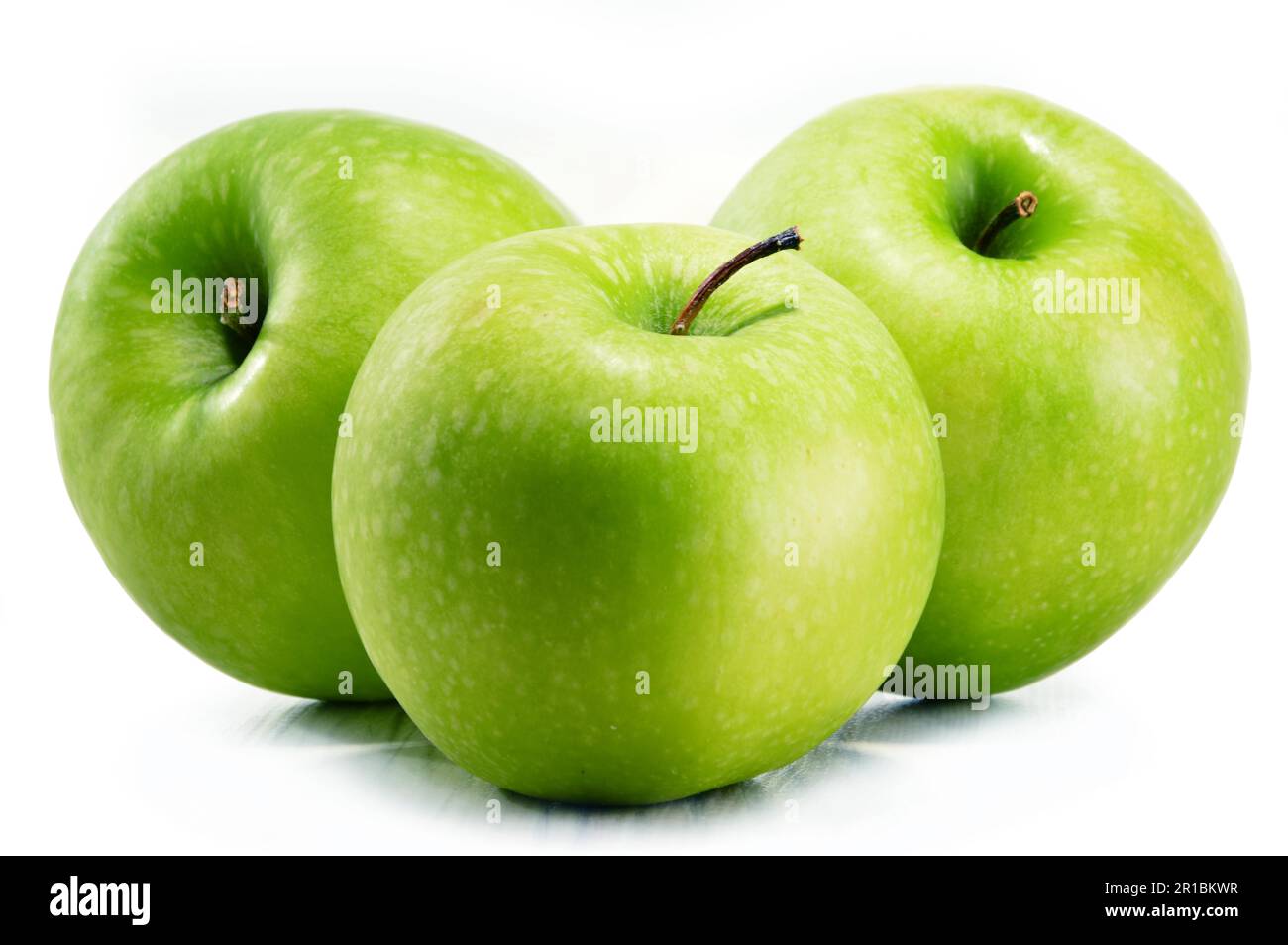 Three green apples isolated on white background Stock Photo - Alamy