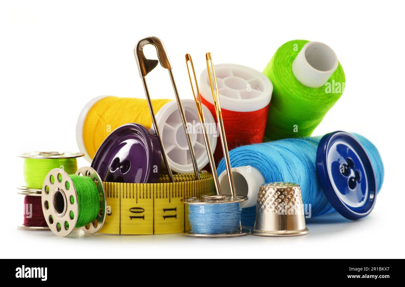 Composition with tailor threads over white background Stock Photo - Alamy
