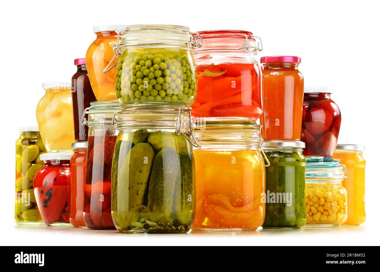 Jars with pickled vegetables, fruity compotes and jams isolated on ...
