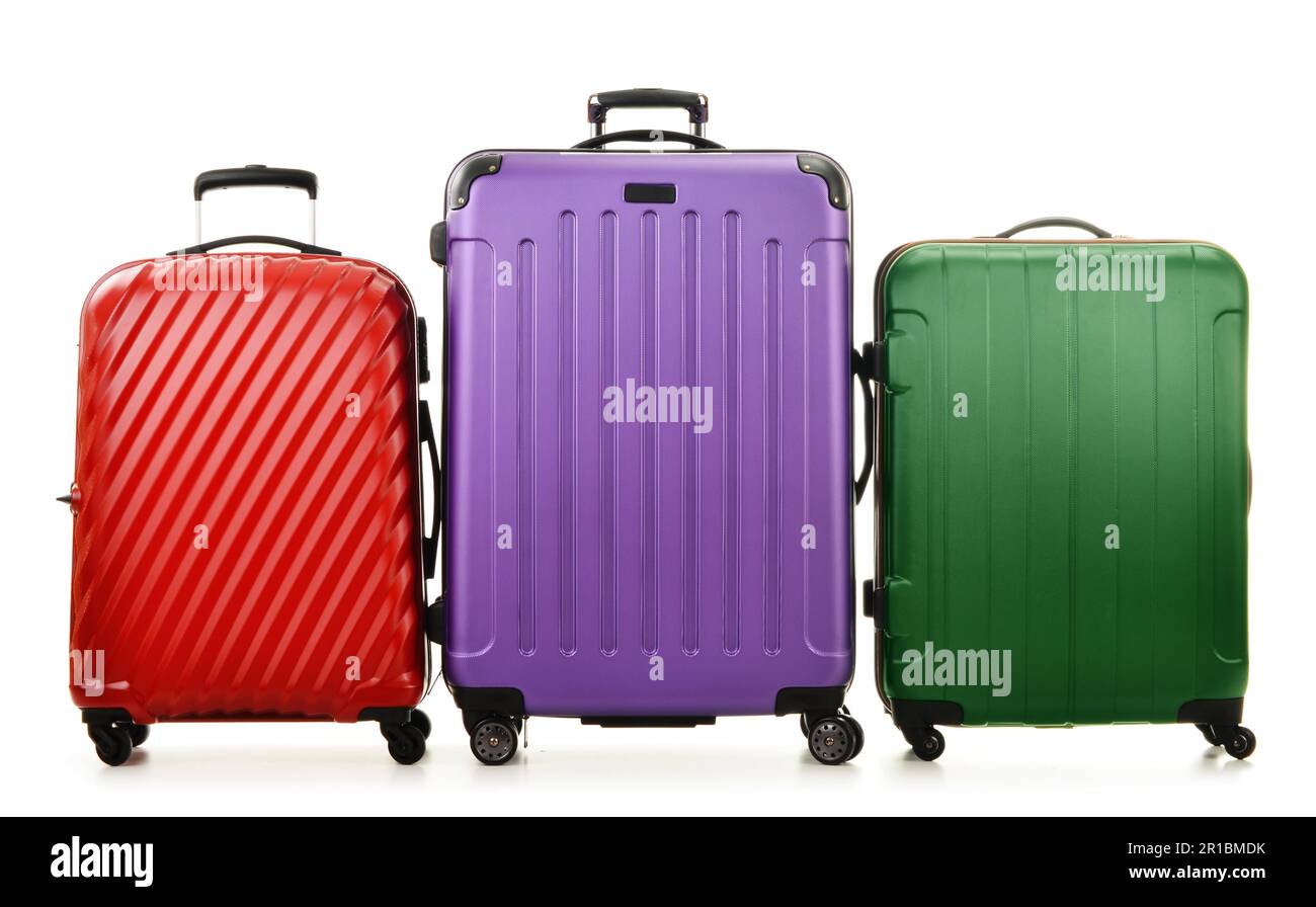 Three suitcases isolated on white background Stock Photo - Alamy