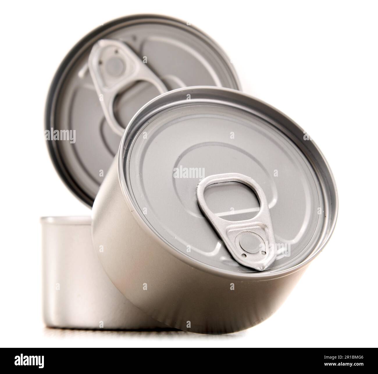 Composition with three metal cans isolated on white Stock Photo - Alamy