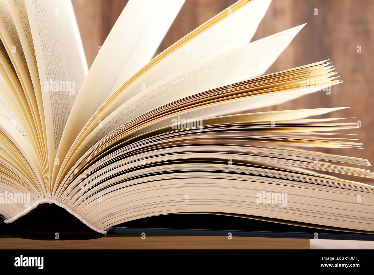 Composition with hardcover book in the library Stock Photo - Alamy