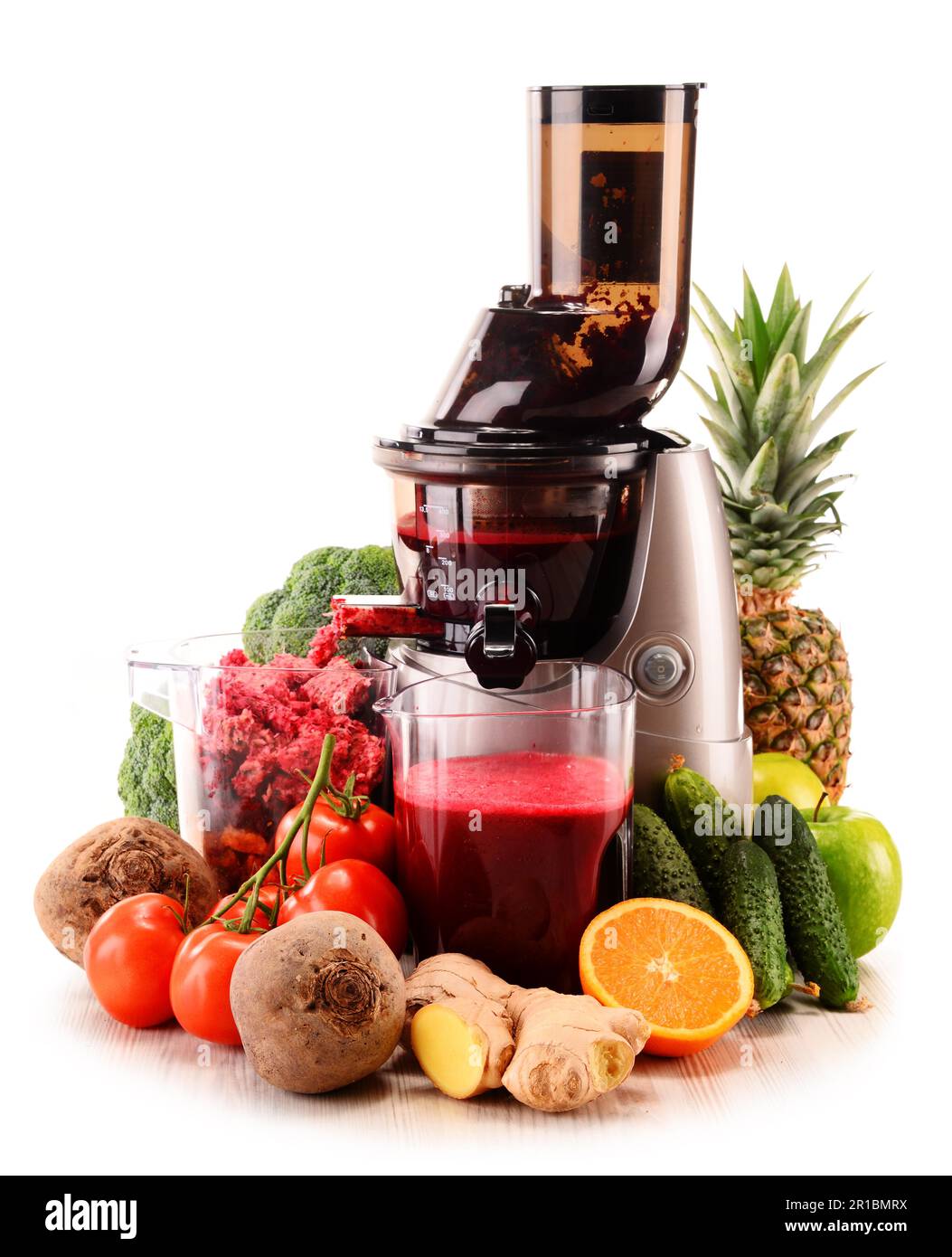 Slow juicer with organic fruits and vegetables isolated on white. Detox ...