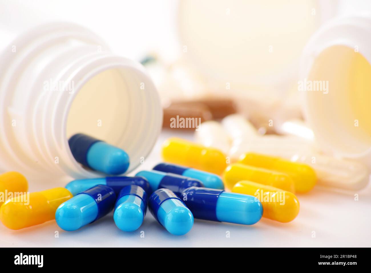Composition with variety of drug pills and container Stock Photo - Alamy