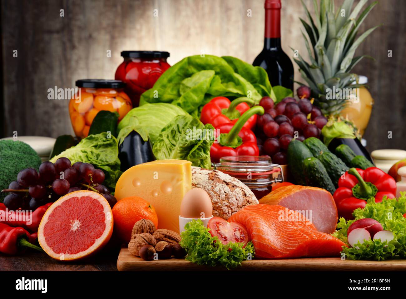 Variety of organic food including vegetables fruit bread dairy and meat ...