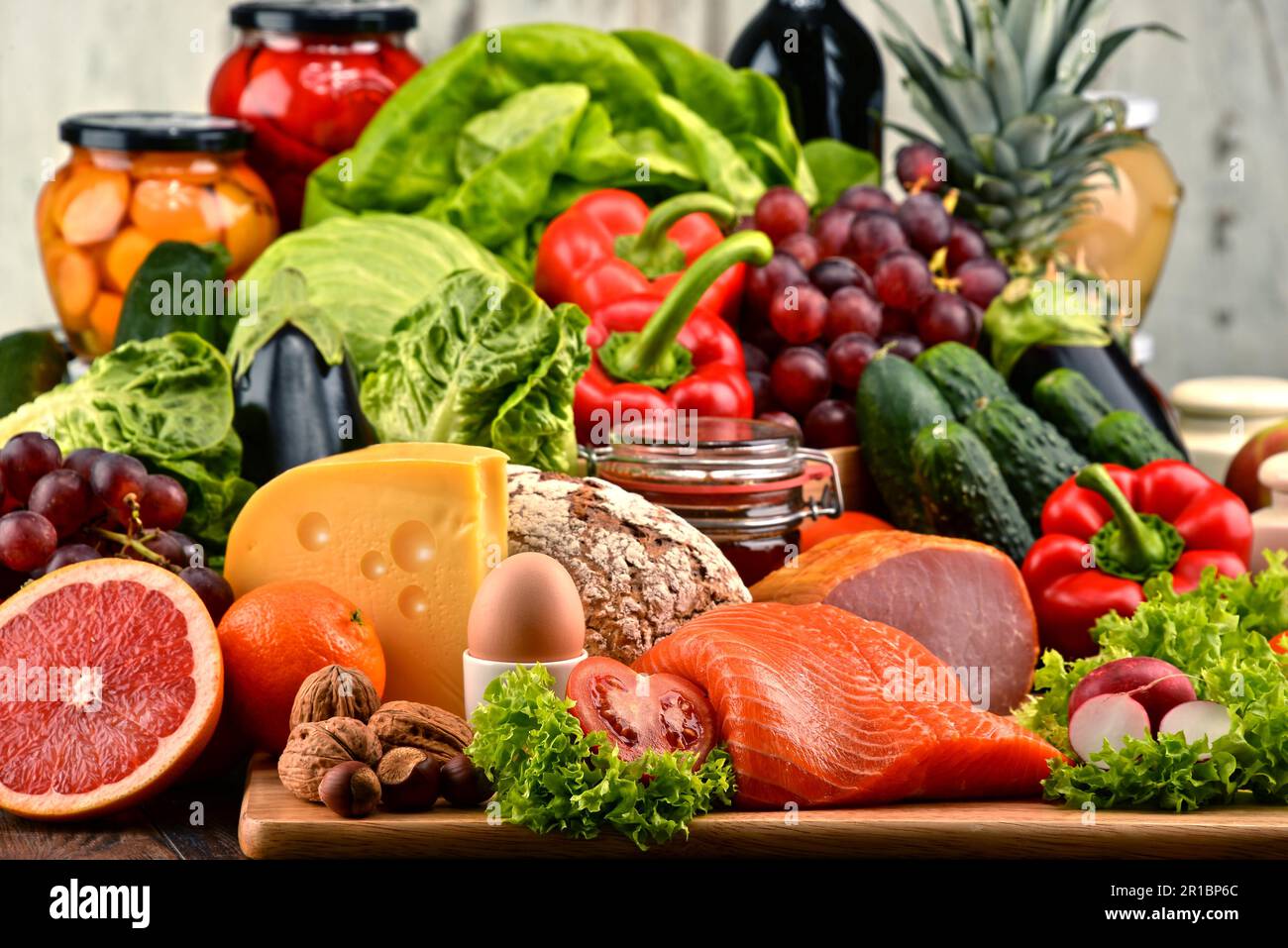 Variety of organic food including vegetables fruit bread dairy and meat ...
