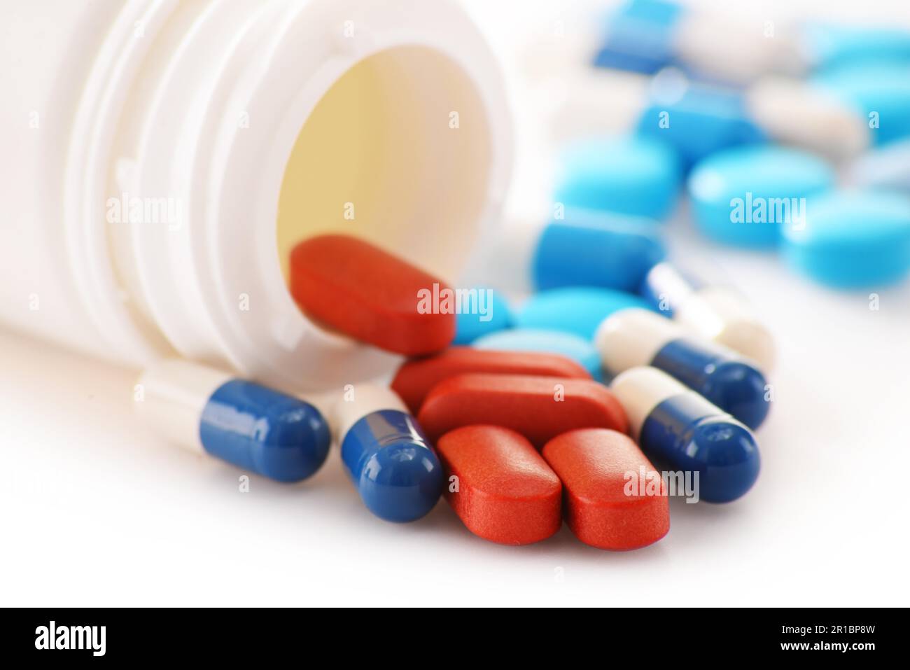 Composition with variety of drug pills and container Stock Photo - Alamy