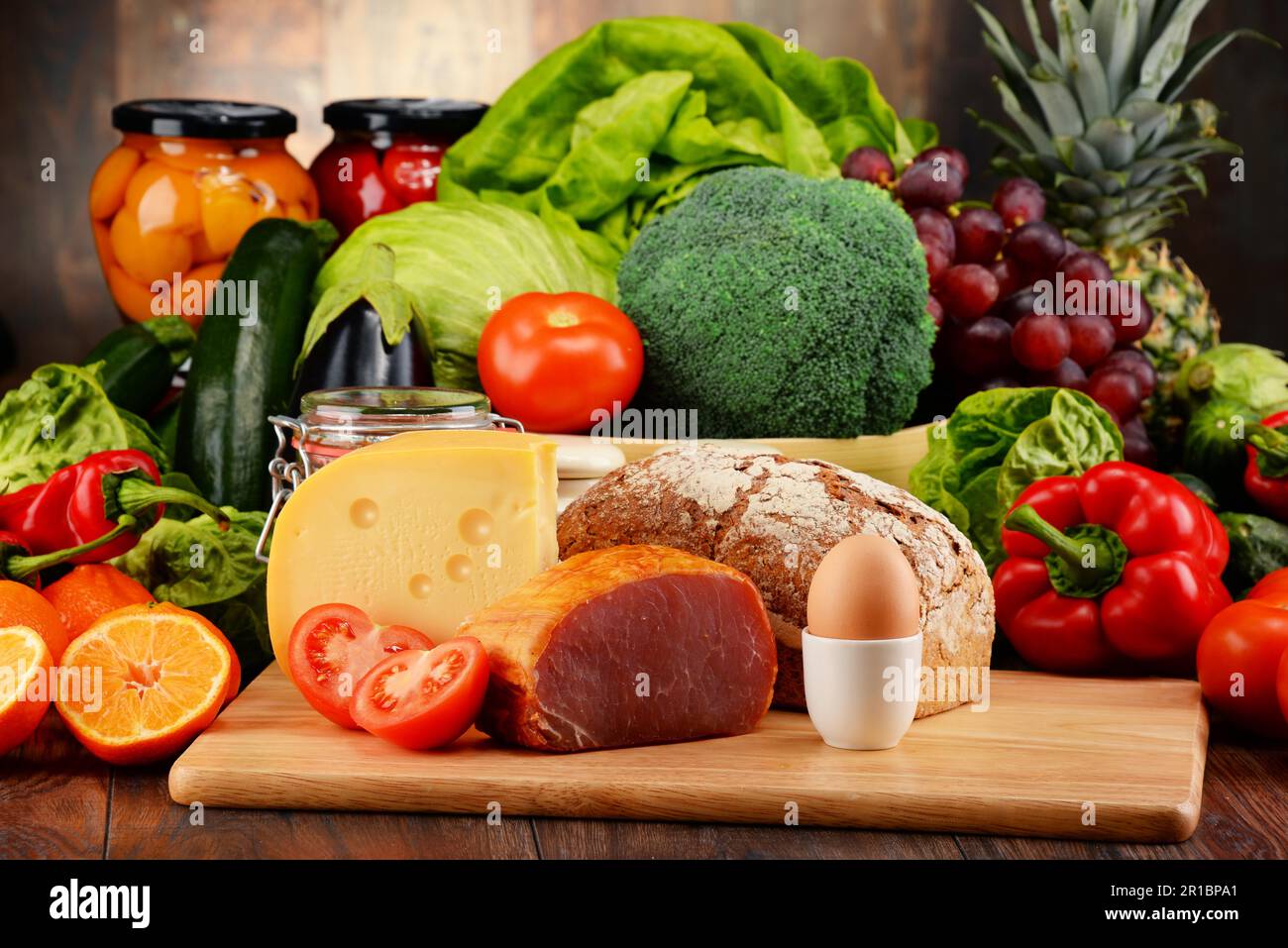 Variety of organic food including vegetables fruit bread dairy and meat ...