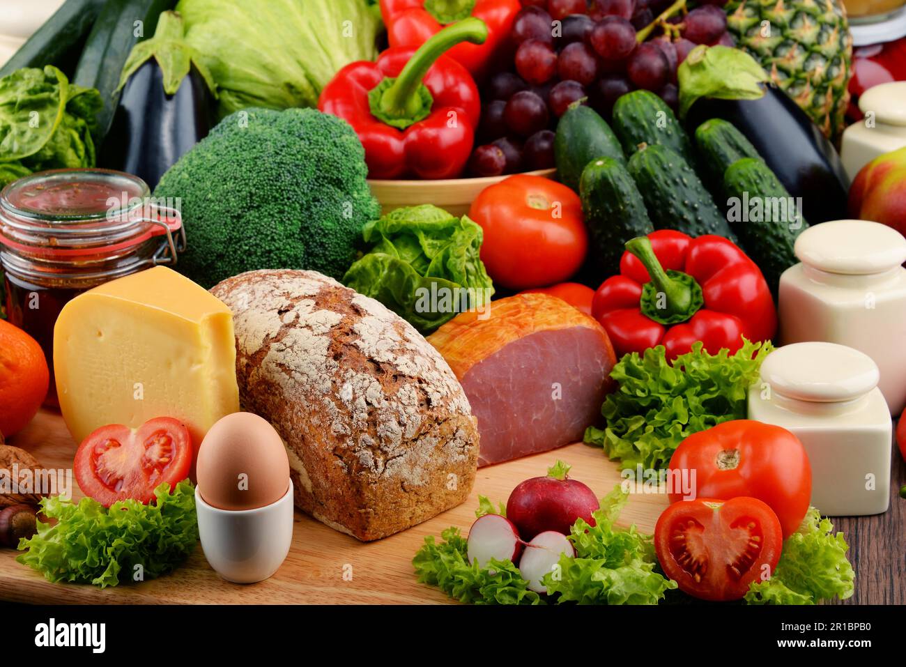 Variety of organic food including vegetables fruit bread dairy and meat ...