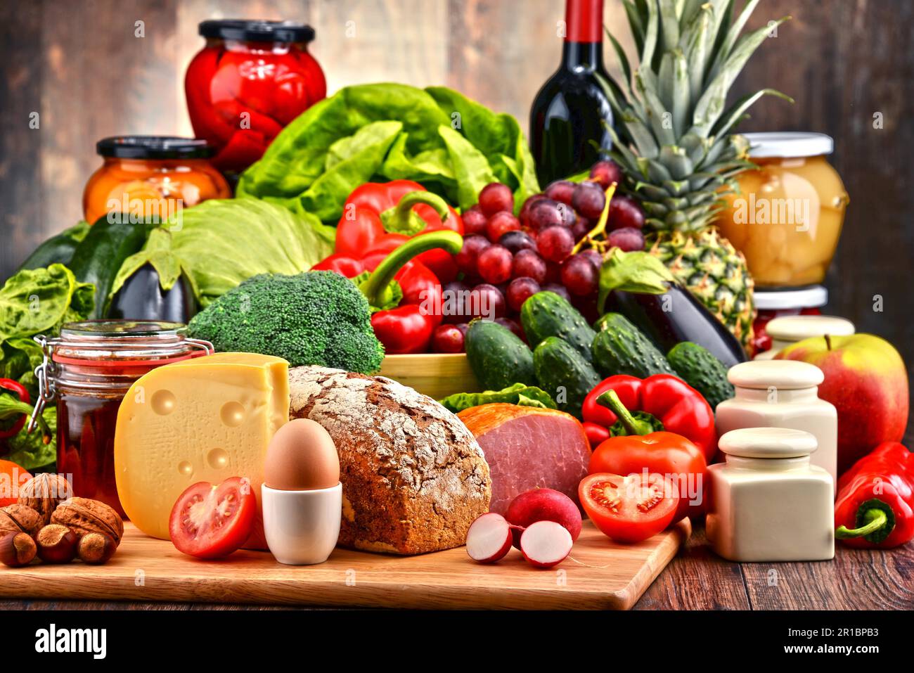 Variety of organic food including vegetables fruit bread dairy and meat ...