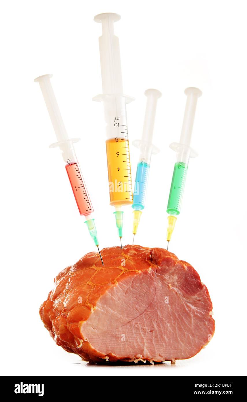 Syringes and meat isolated on white. Genetically modified food. GMO ...