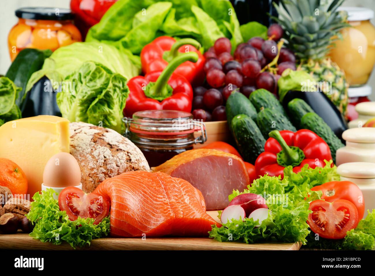 Variety of organic food including vegetables fruit bread dairy and meat ...
