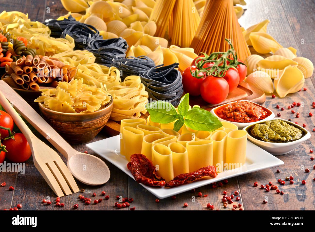 Composition with variety of pasta on kitchen table Stock Photo - Alamy