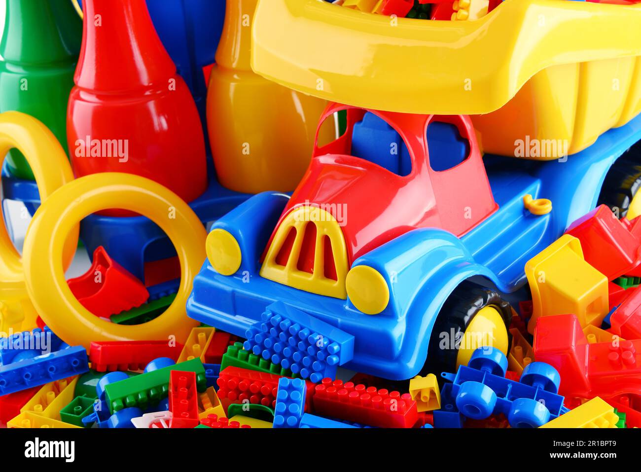Composition with colorful plastic children toys Stock Photo - Alamy