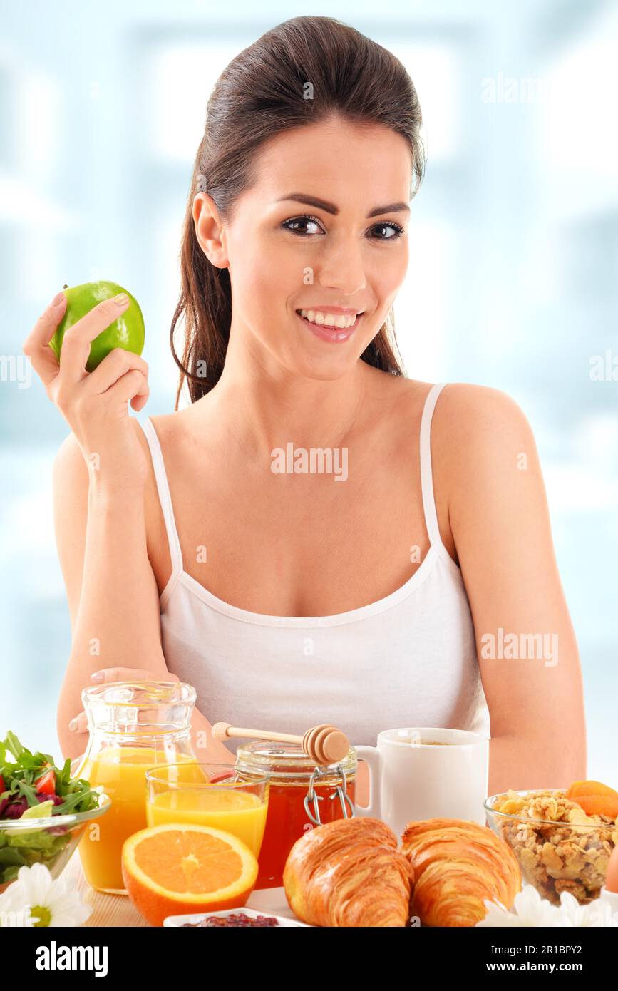 Woman having breakfast coffee croissant hi-res stock photography and images - Alamy