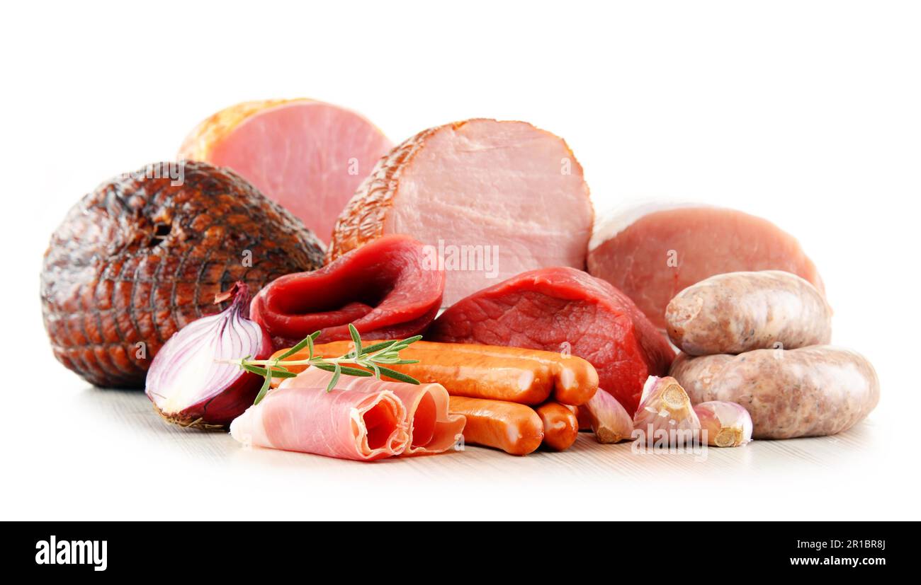Assorted meat products including ham and sausages isolated on white ...