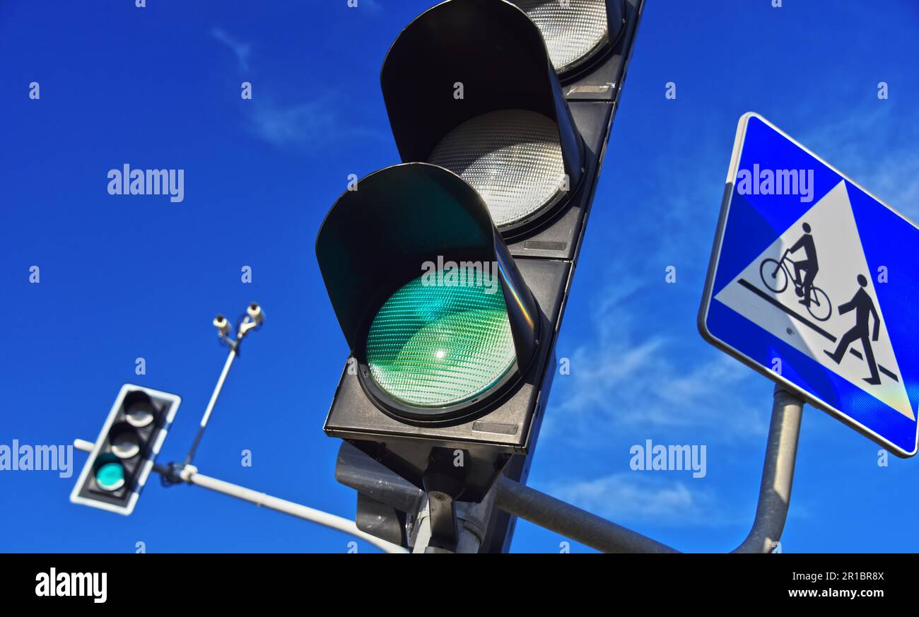 Traffic lights over blue sky. Green light Stock Photo - Alamy