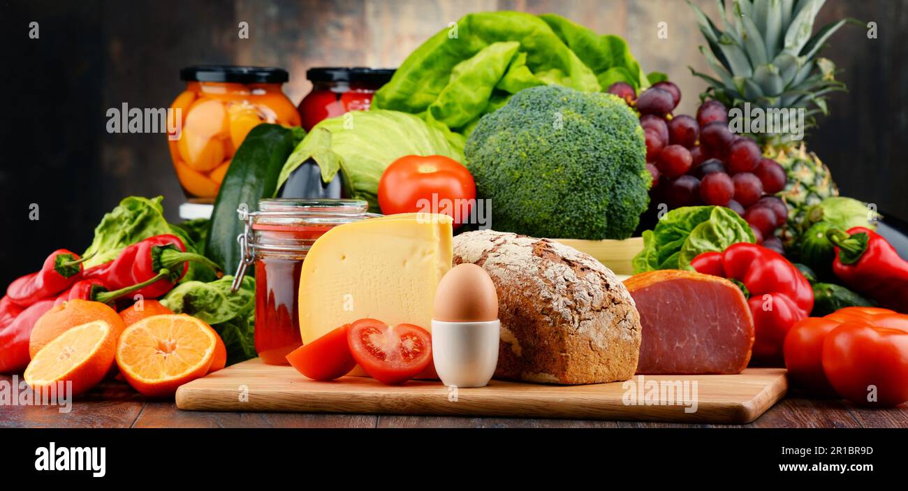 Variety of organic food including vegetables fruit bread dairy and meat ...