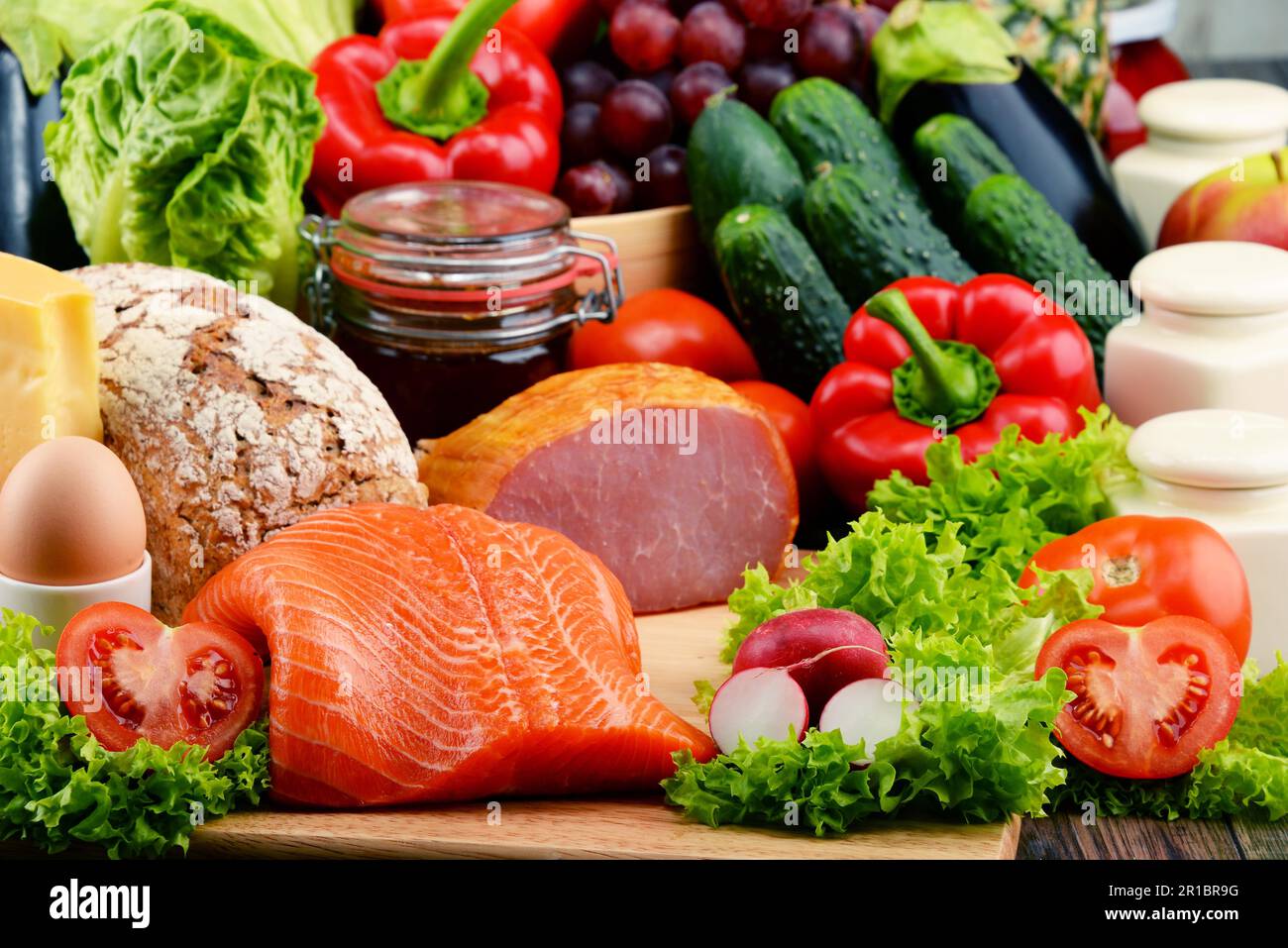 Variety of organic food including vegetables, fruit, bread, dairy and ...