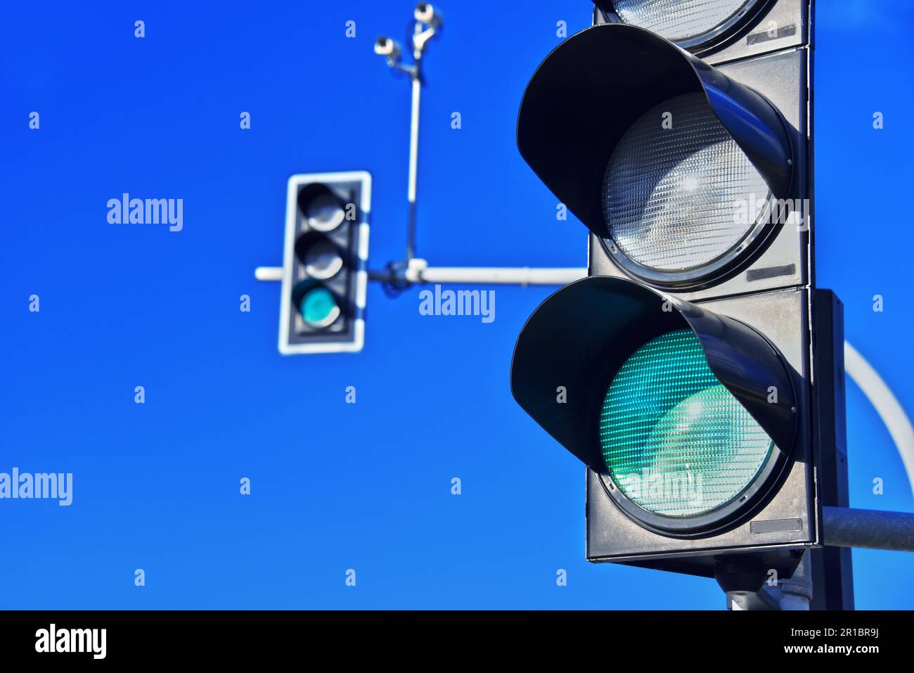 Traffic lights over blue sky. Green light Stock Photo - Alamy