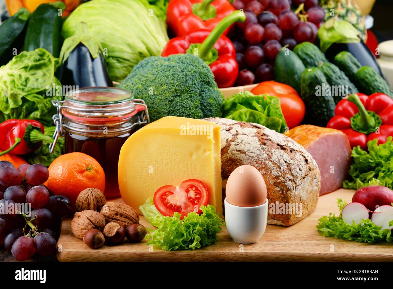Variety of organic food including vegetables fruit bread dairy and meat ...