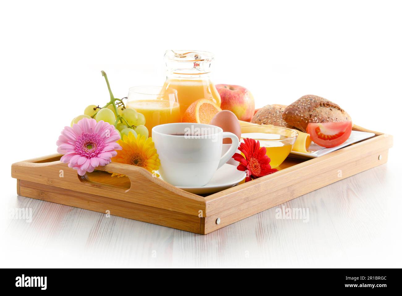 Breakfast on tray served with coffee, orange juice, egg, rolls and honey. Balanced diet Stock ...