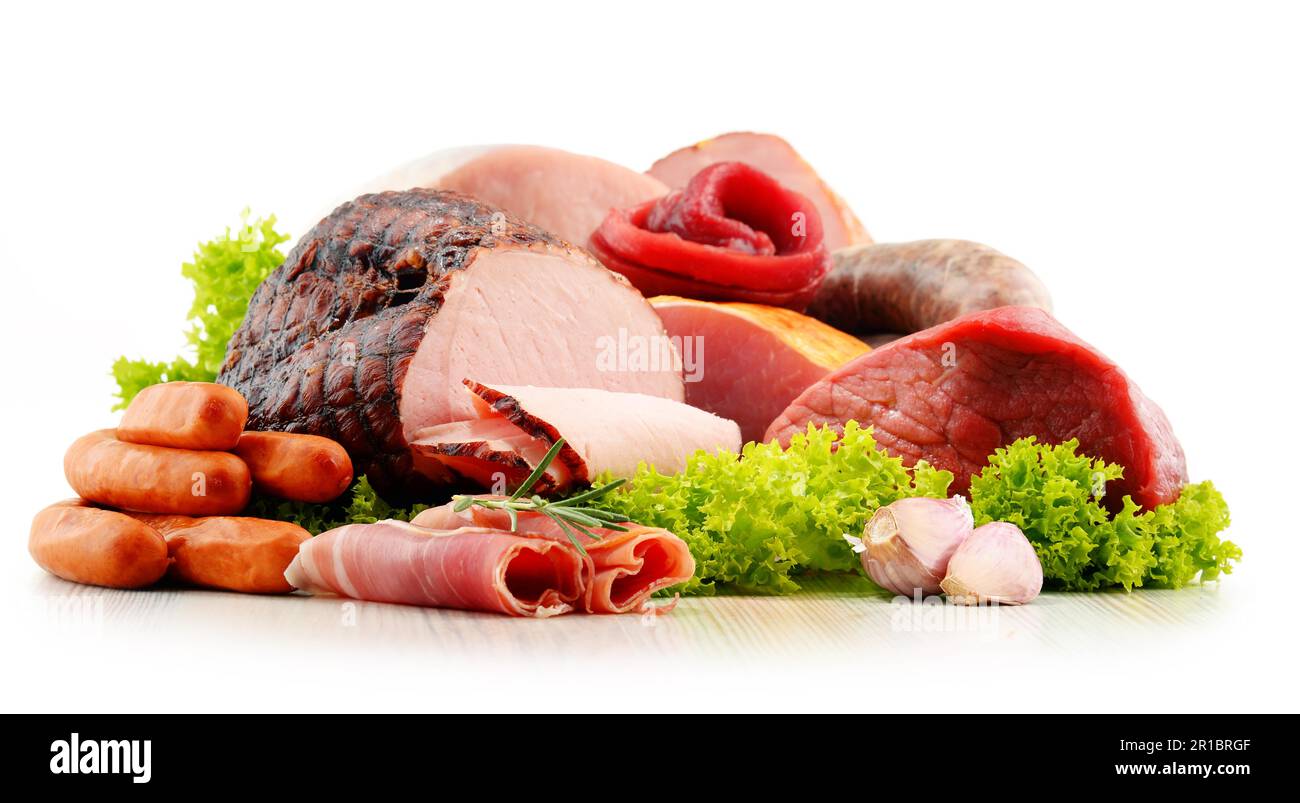 Assorted meat products including ham and sausages isolated on white ...