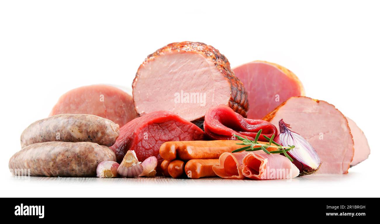 Assorted meat products including ham and sausages isolated on white ...
