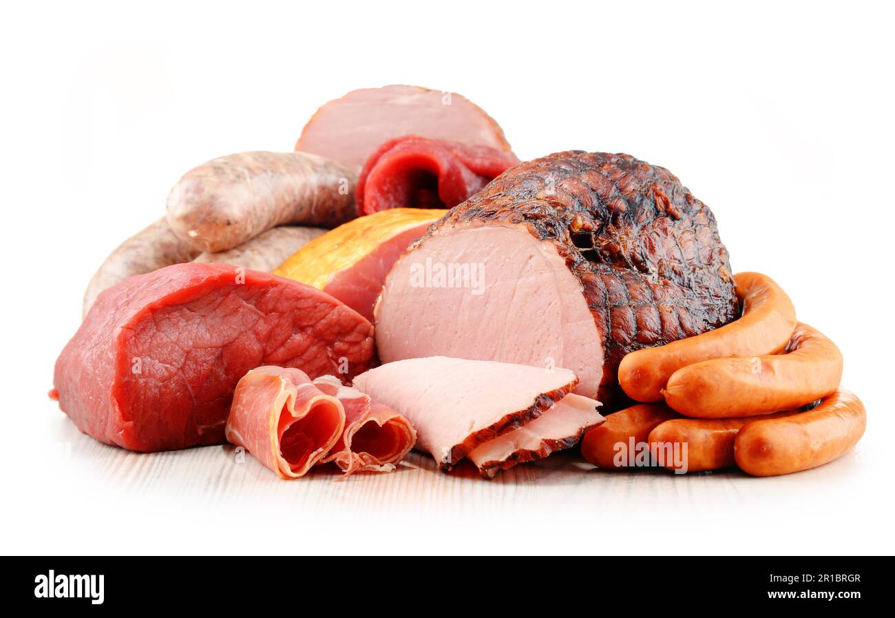 Assorted meat products including ham and sausages isolated on white ...
